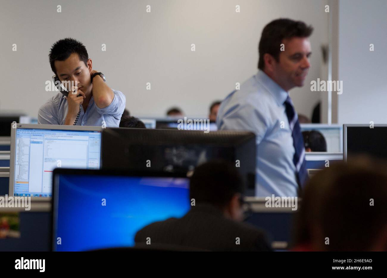 London traders on the floor of the IG Index in the City this afternoon ...