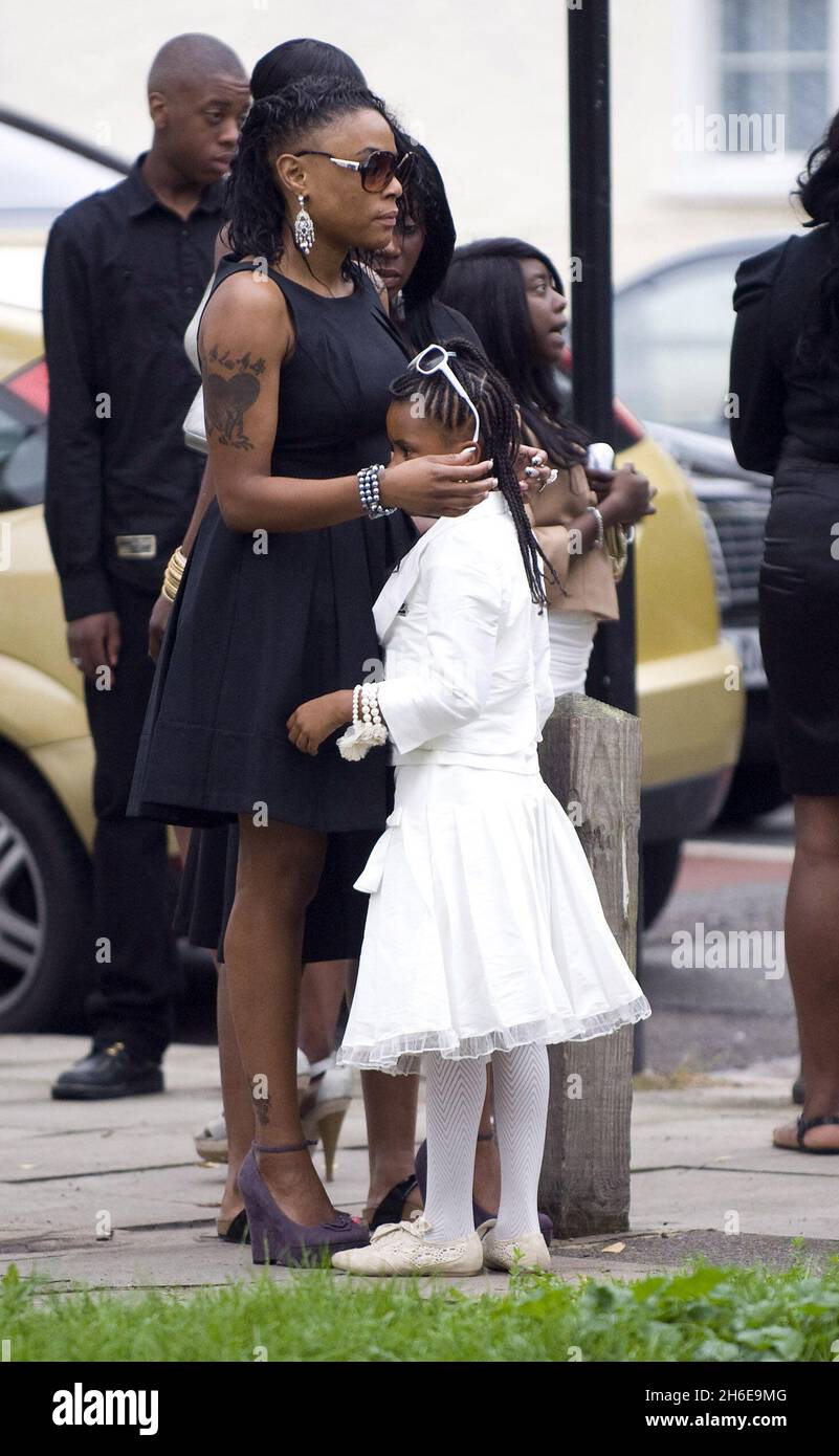 Family members pictured outside the family home in North London today ...