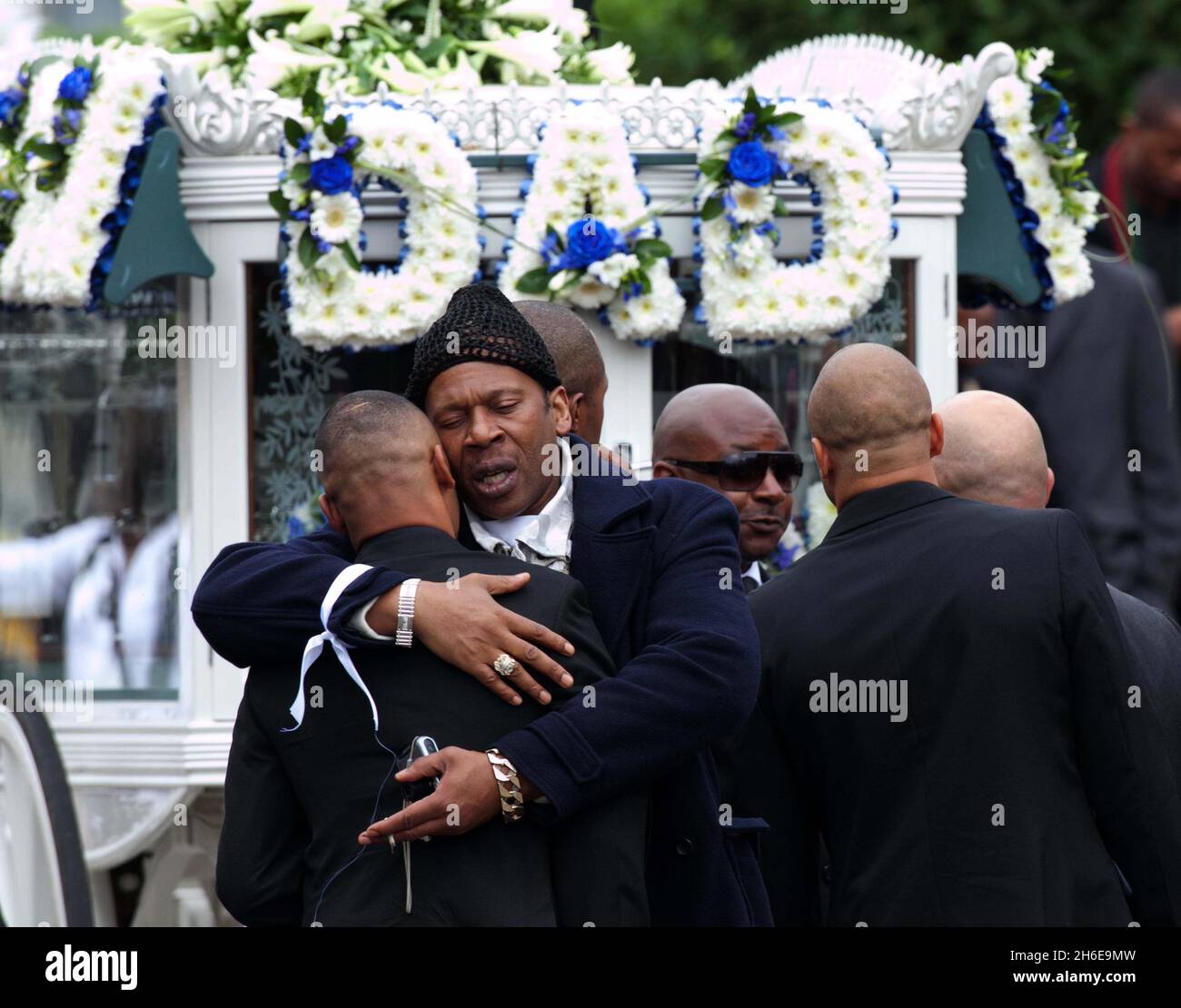 The funeral procession arrives at the New Testament Church of God in ...
