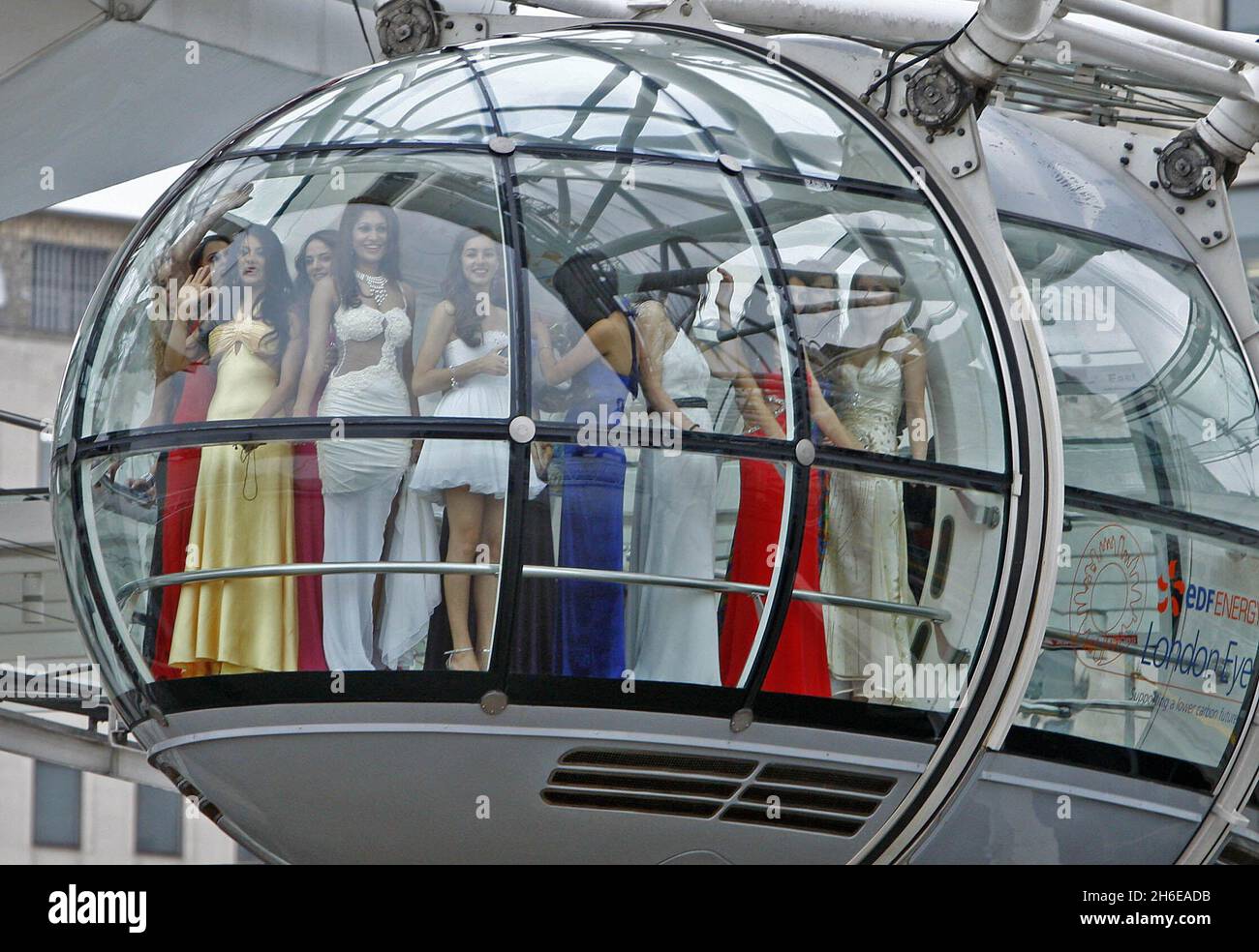 Miss World 2011 contestants enjoy a ride on the London Eye after posing ...