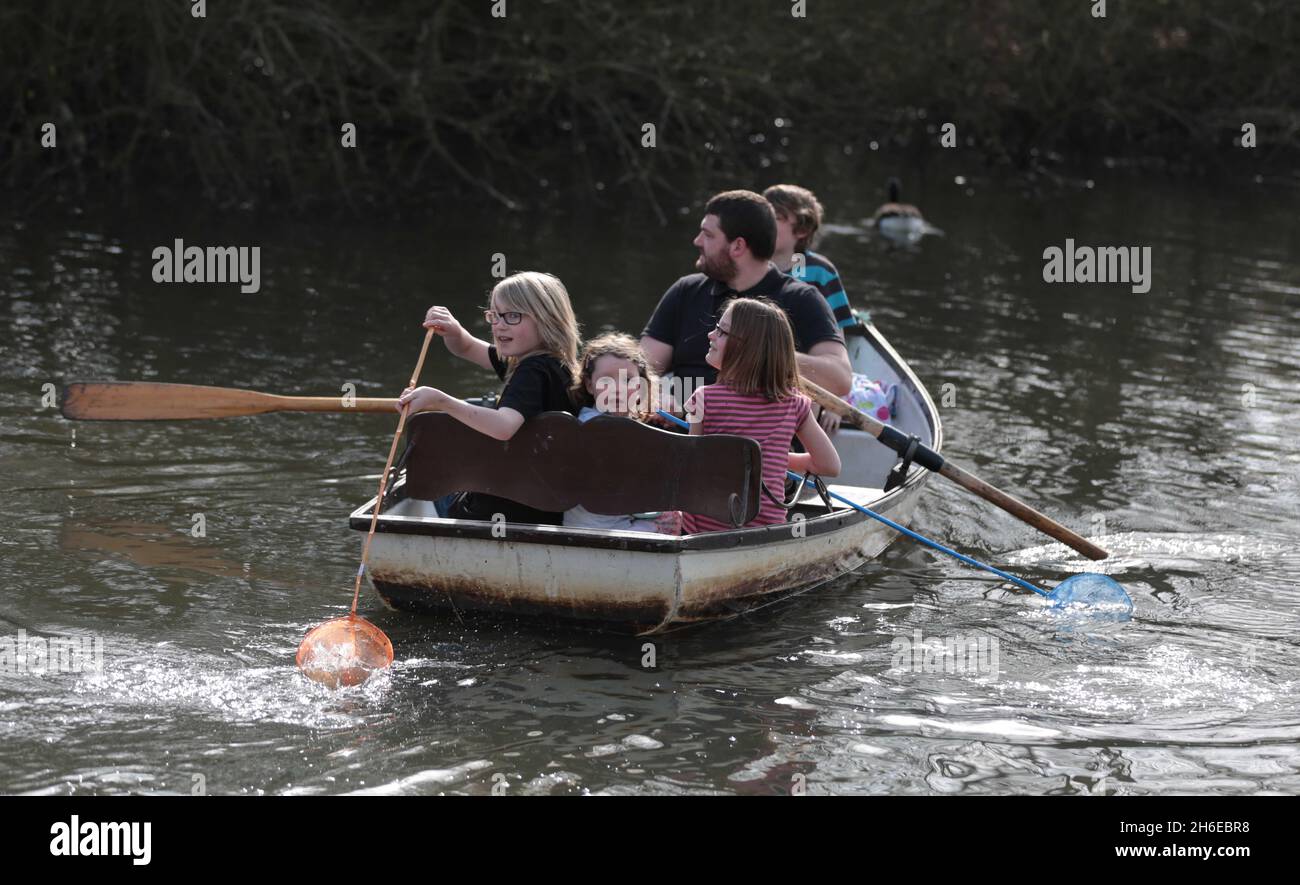 A family enjoy rowing on Hollow Ponds in Upper Leytonstone in East ...