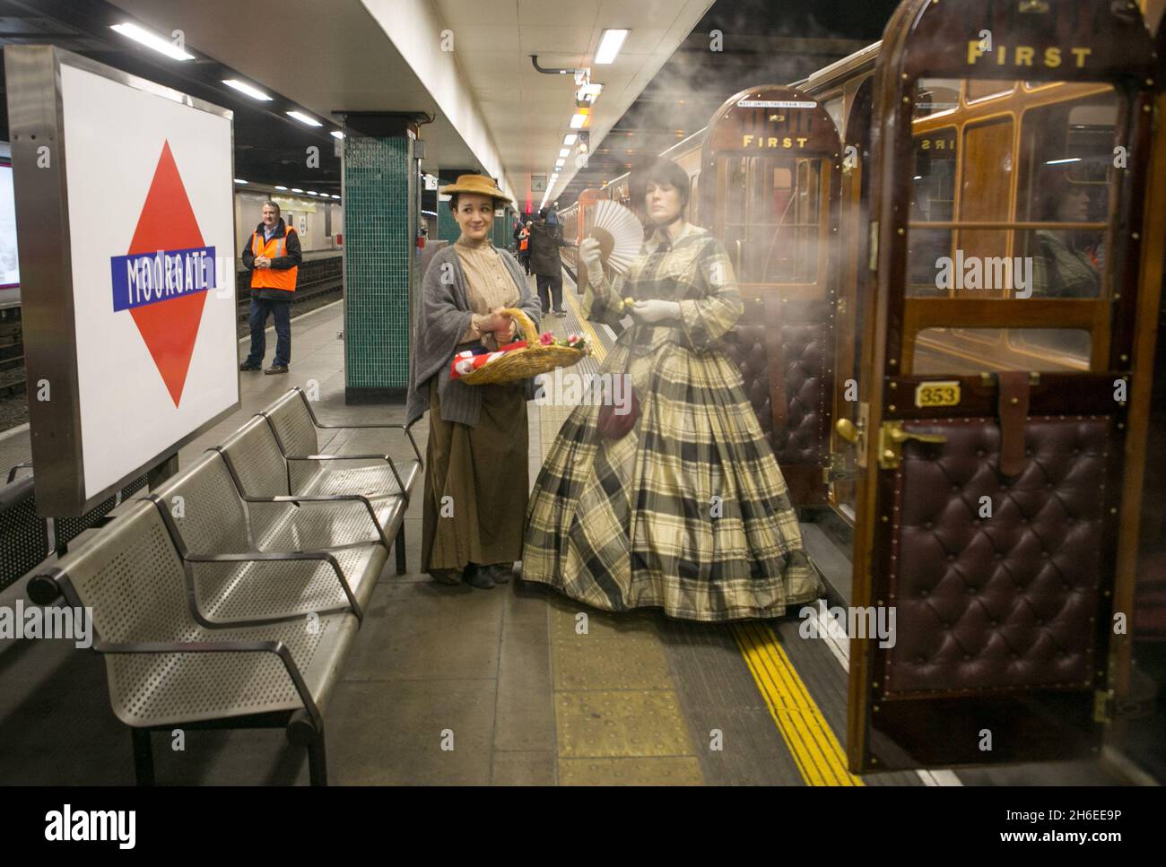 Women in Victorian dress alight a steam train on its journey from ...