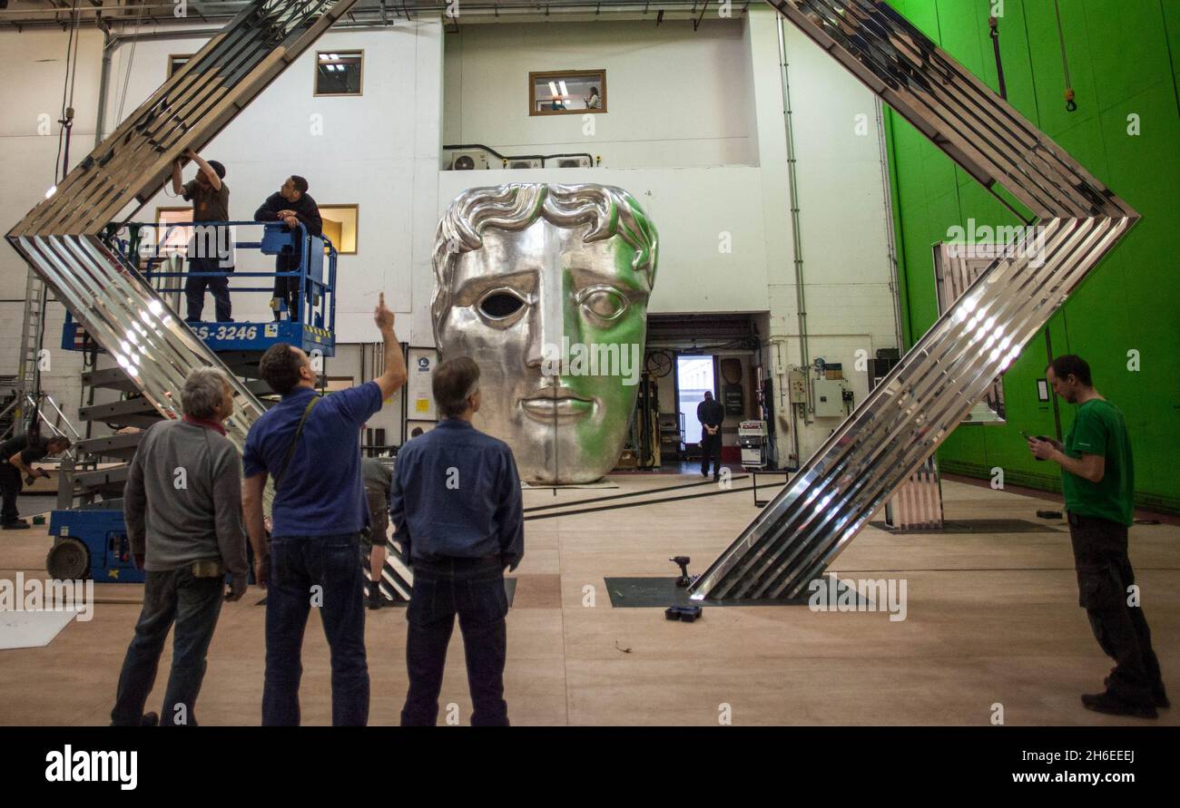 Finishes touches are made to the BAFTA stage set backstage at the Royal ...