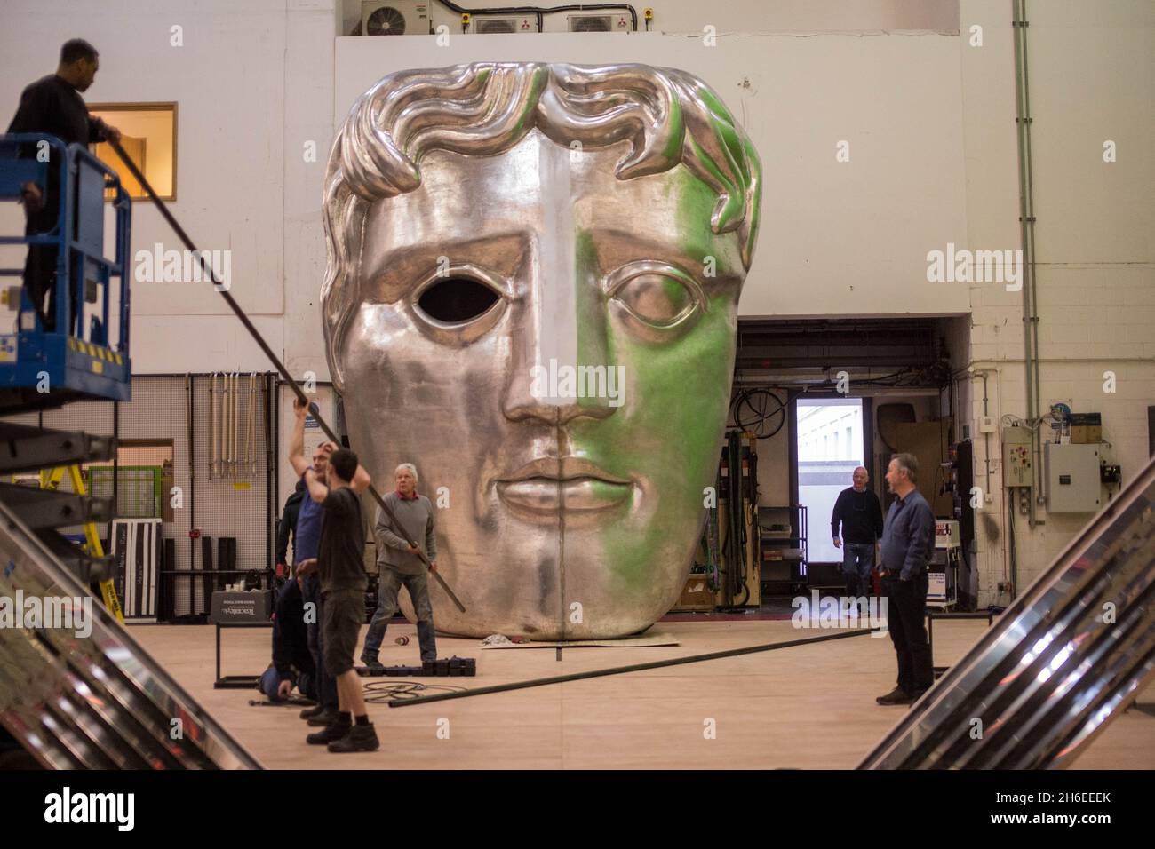 Finishes touches are made to the BAFTA stage set backstage at the Royal ...