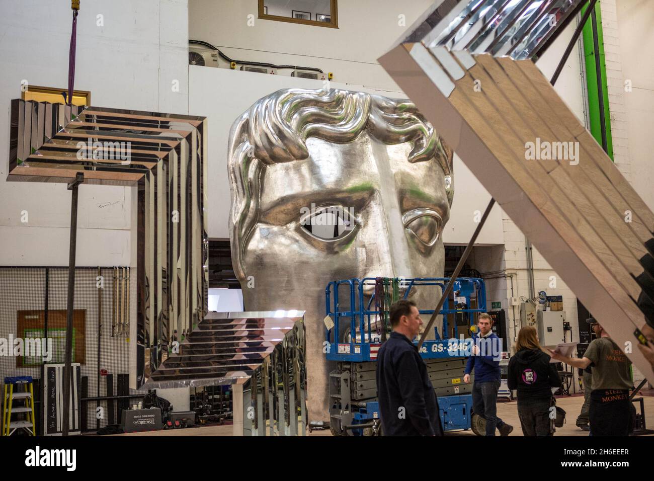 Finishes touches are made to the BAFTA stage set backstage at the Royal ...