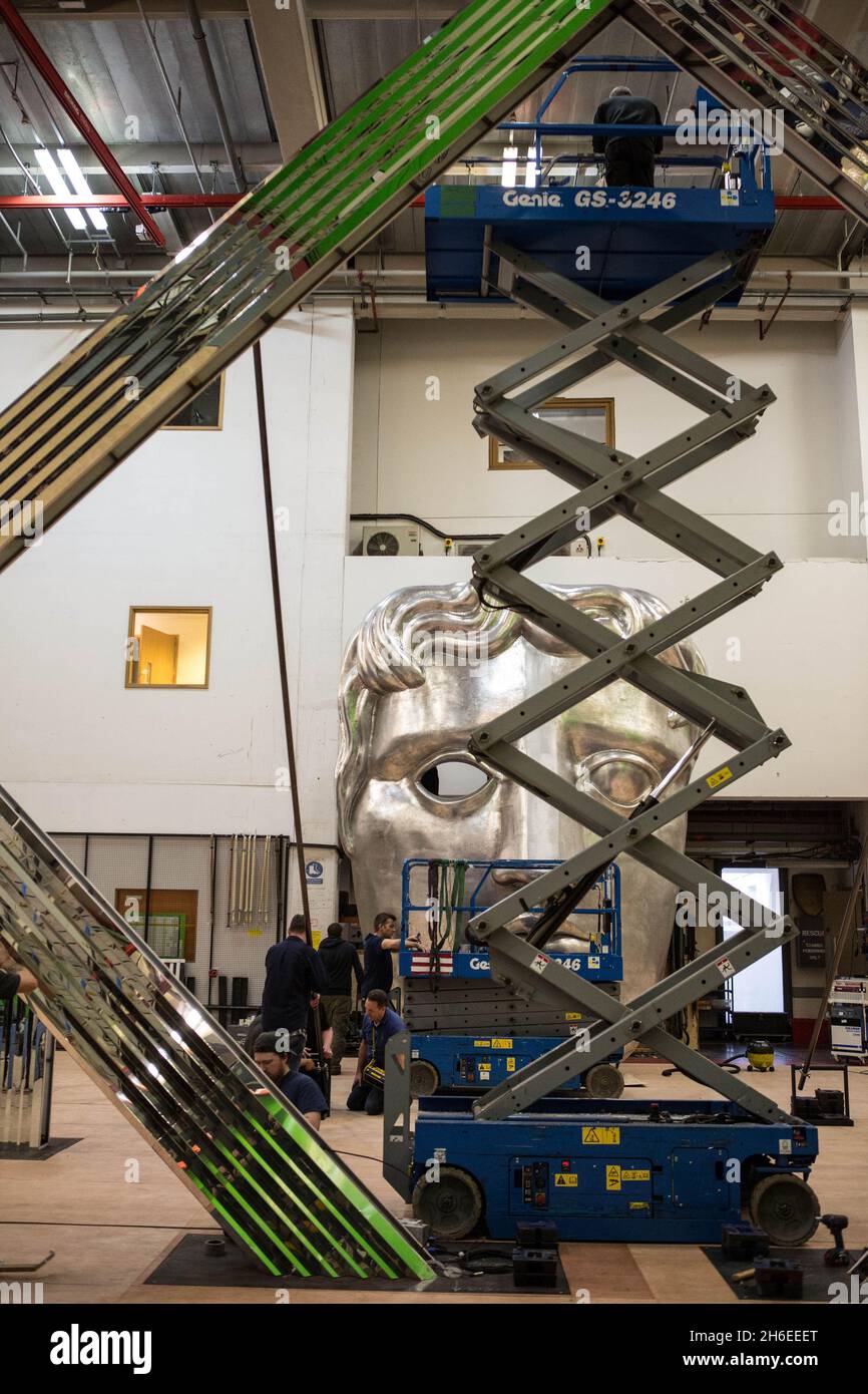 Finishes touches are made to the BAFTA stage set backstage at the Royal ...