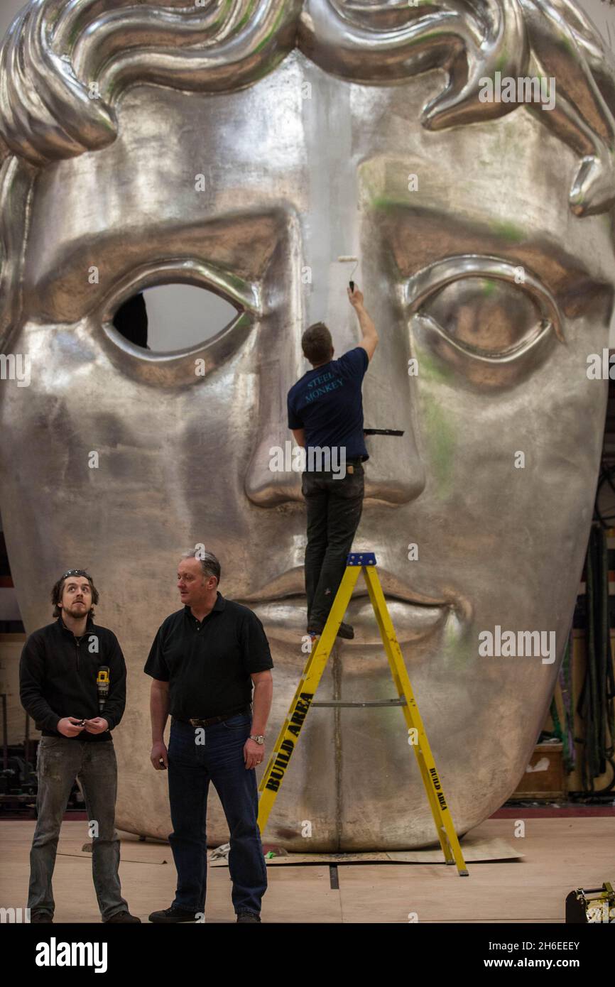 Finishes touches are made to the BAFTA stage set backstage at the Royal ...