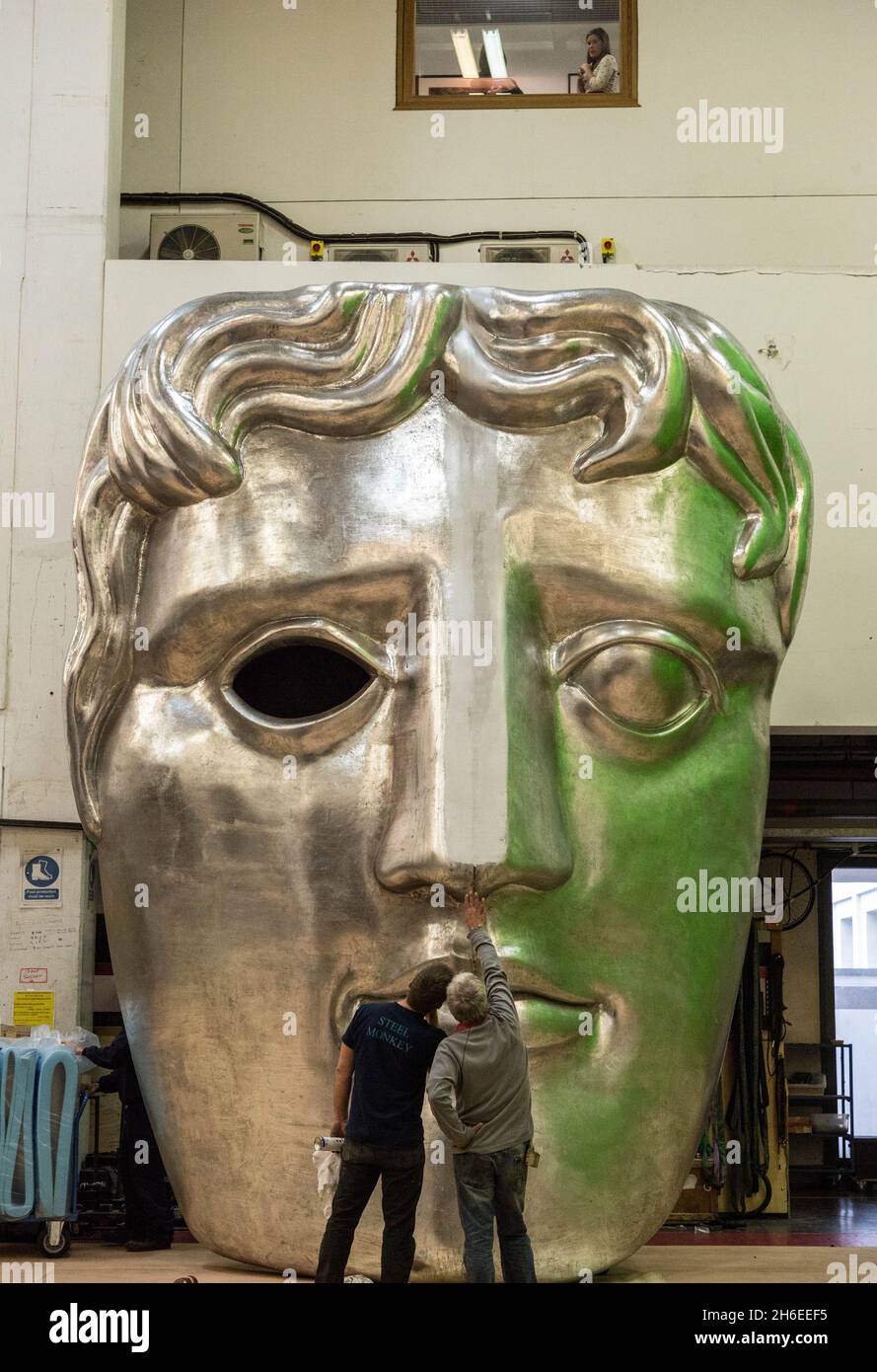 Finishes touches are made to the BAFTA stage set backstage at the Royal ...