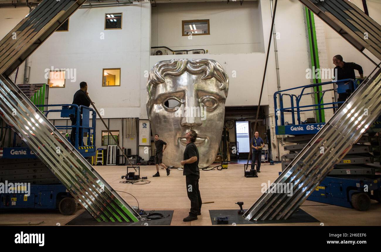 Finishes touches are made to the BAFTA stage set backstage at the Royal ...