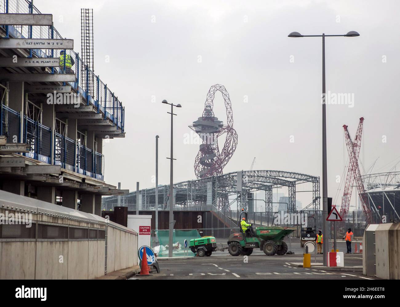 Builders pictured taking down parts of the Olympic site at Olympic Park ...