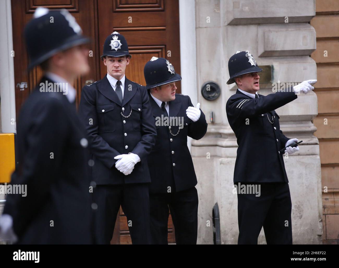 Police officers gather near St Paul's cathedral this morning for the ...