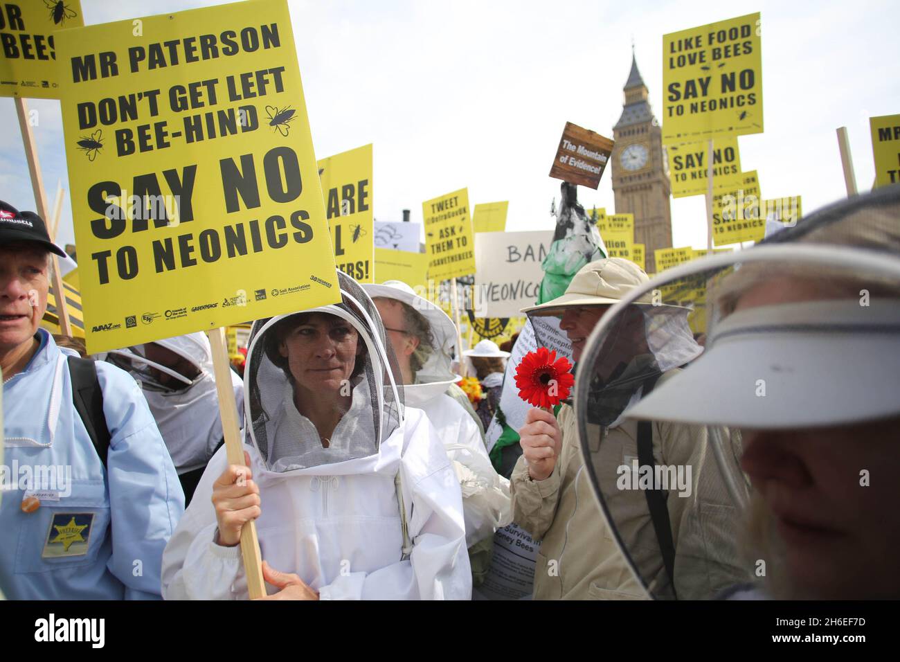 A group of beekeepers and enthusiasts including fashion designer ...
