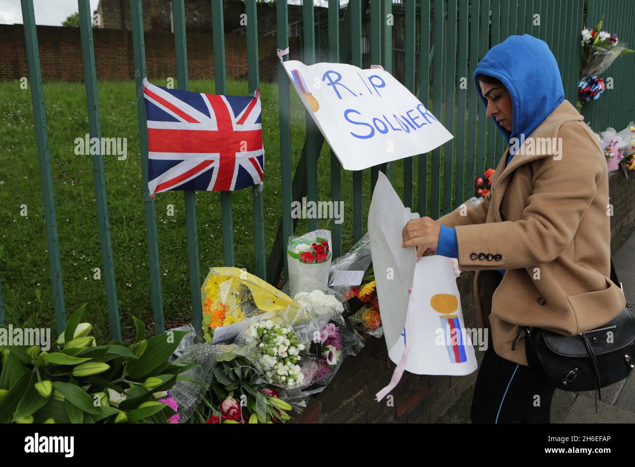 Flowers and tributes are left at the scene in Woolwich where Drummer ...