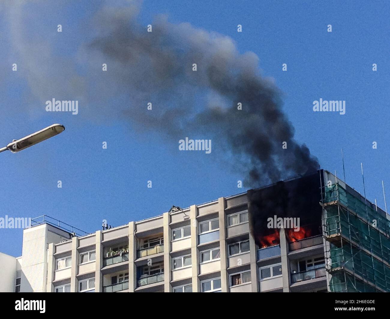 Firefighters tackle a blaze in a residential block of flats off ...