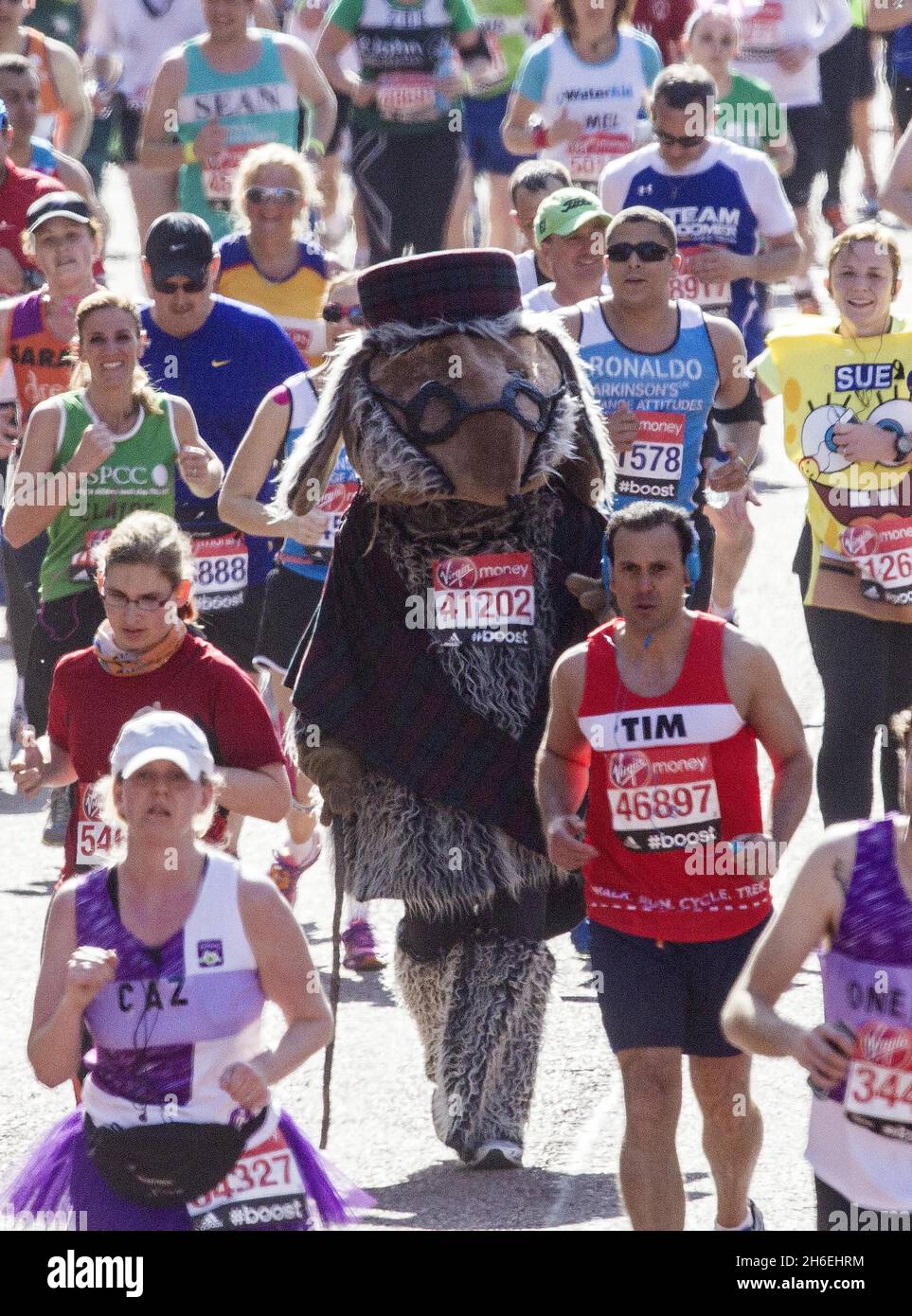 A runner dressed as a Womble at the finish line at the London Marathon ...