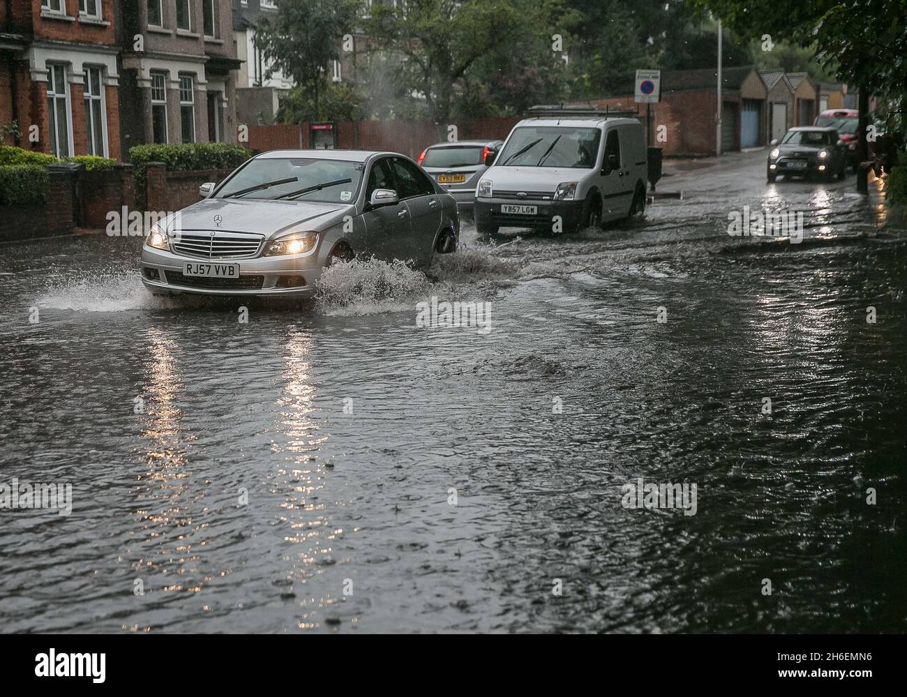 A flooded road in Leytonstone in East London as forecasters are tonight ...