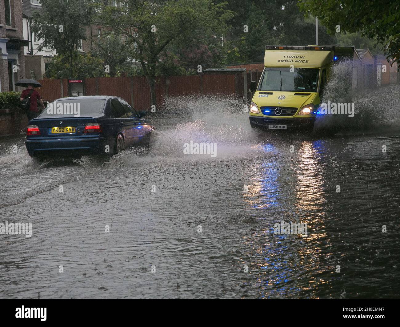 A flooded road in Leytonstone in East London as forecasters are tonight ...