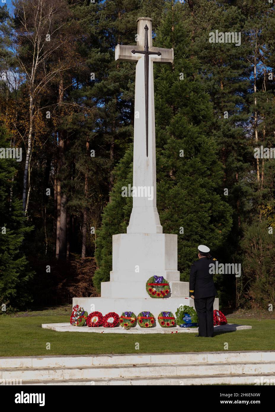 A naval officer salutes the Cross of Sacrifice in the Canadian part of ...