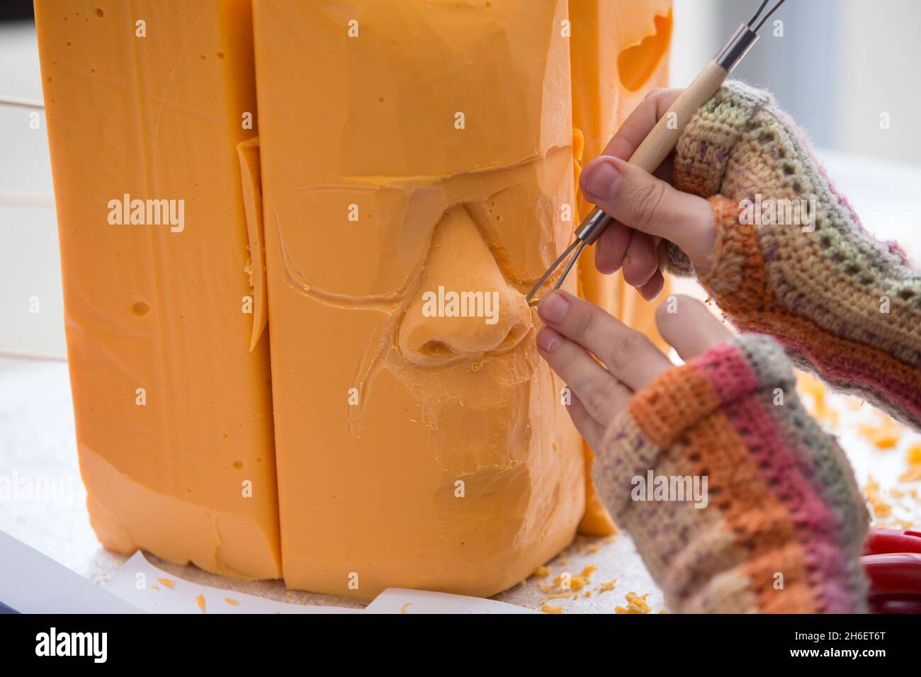 Competitors participate in the East Village E20 Cheese Carving ...
