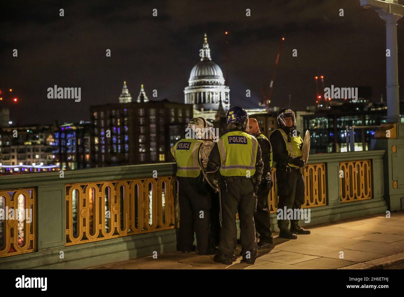 RIOT POLICE ARREST A MAN ON SOUTHWARK BRIDGE DURING AN ONGOING INCIDENT ...