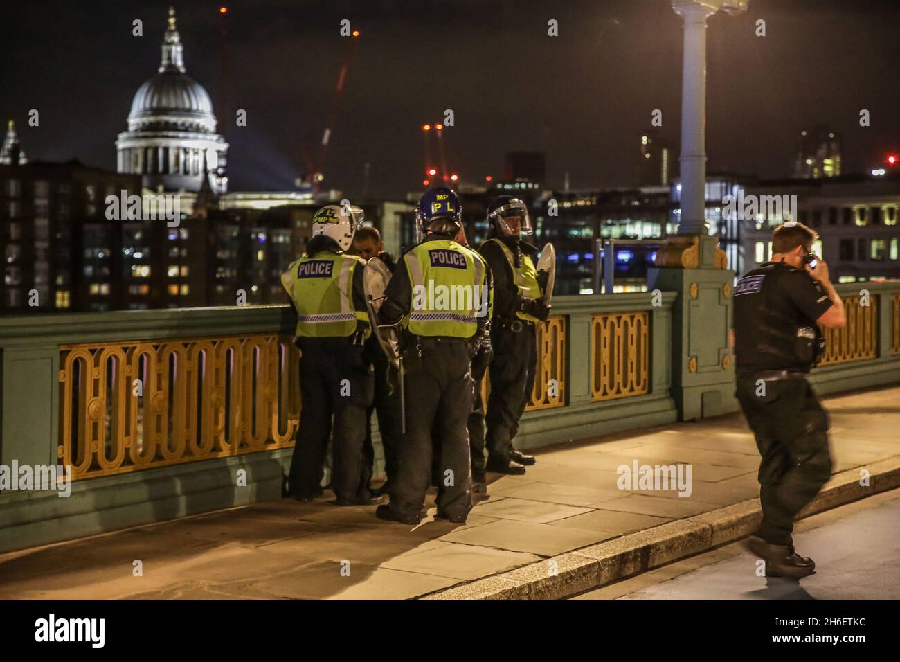RIOT POLICE ARREST A MAN ON SOUTHWARK BRIDGE DURING AN ONGOING INCIDENT ...