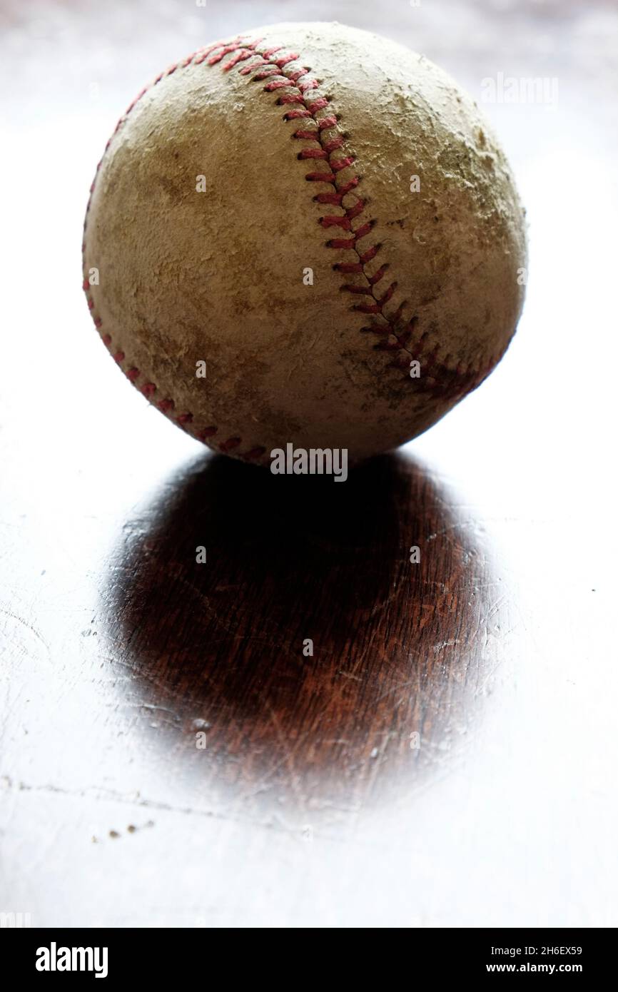Old worn leather baseball on wood with light Stock Photo - Alamy