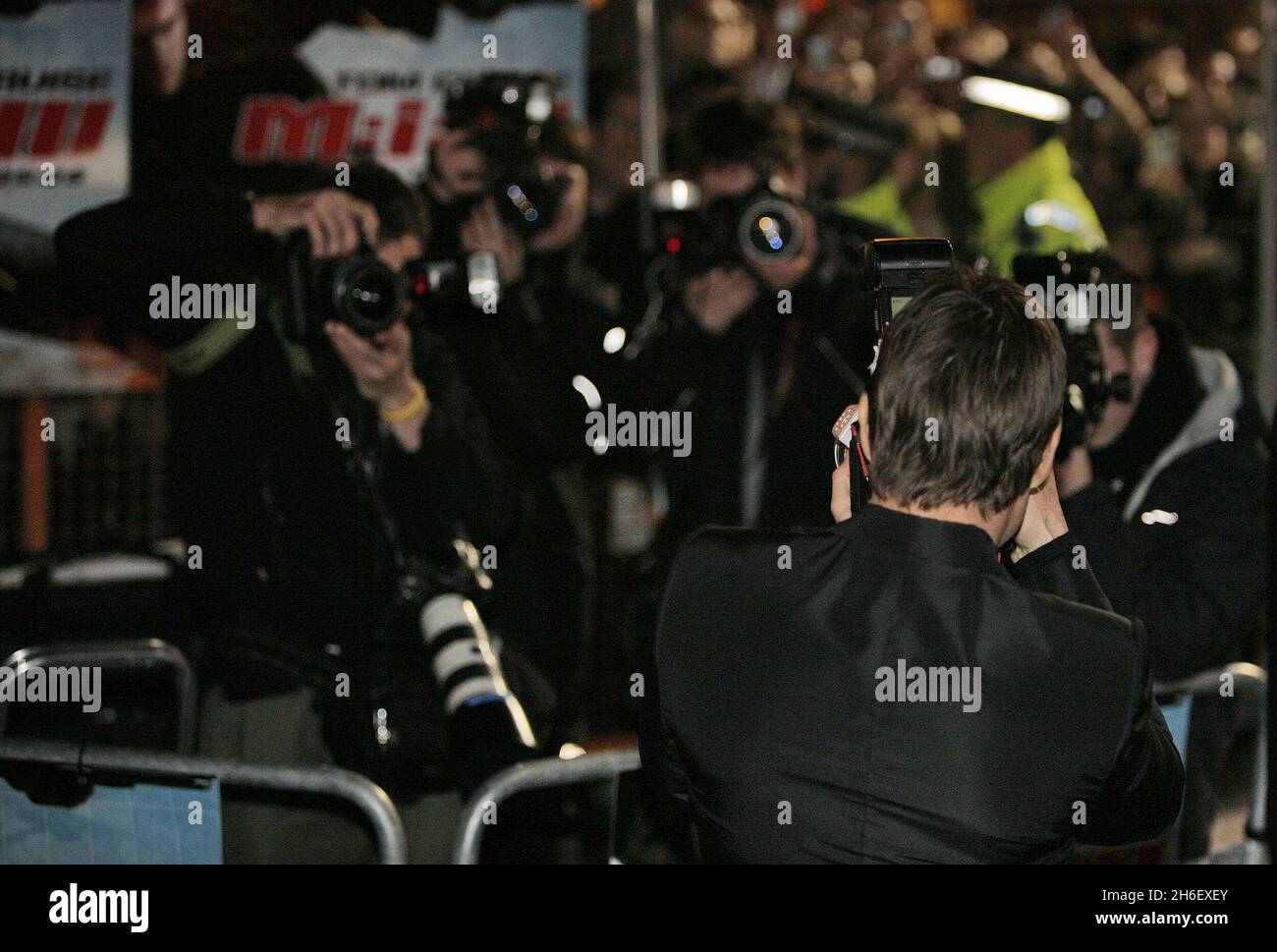 Tom Cruise takes one of the photographers cameras to capture his fans ...