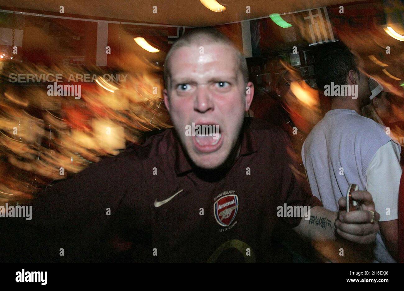 Arsenal fans celebrate their fist goal against Barcelona in the Gunner ...