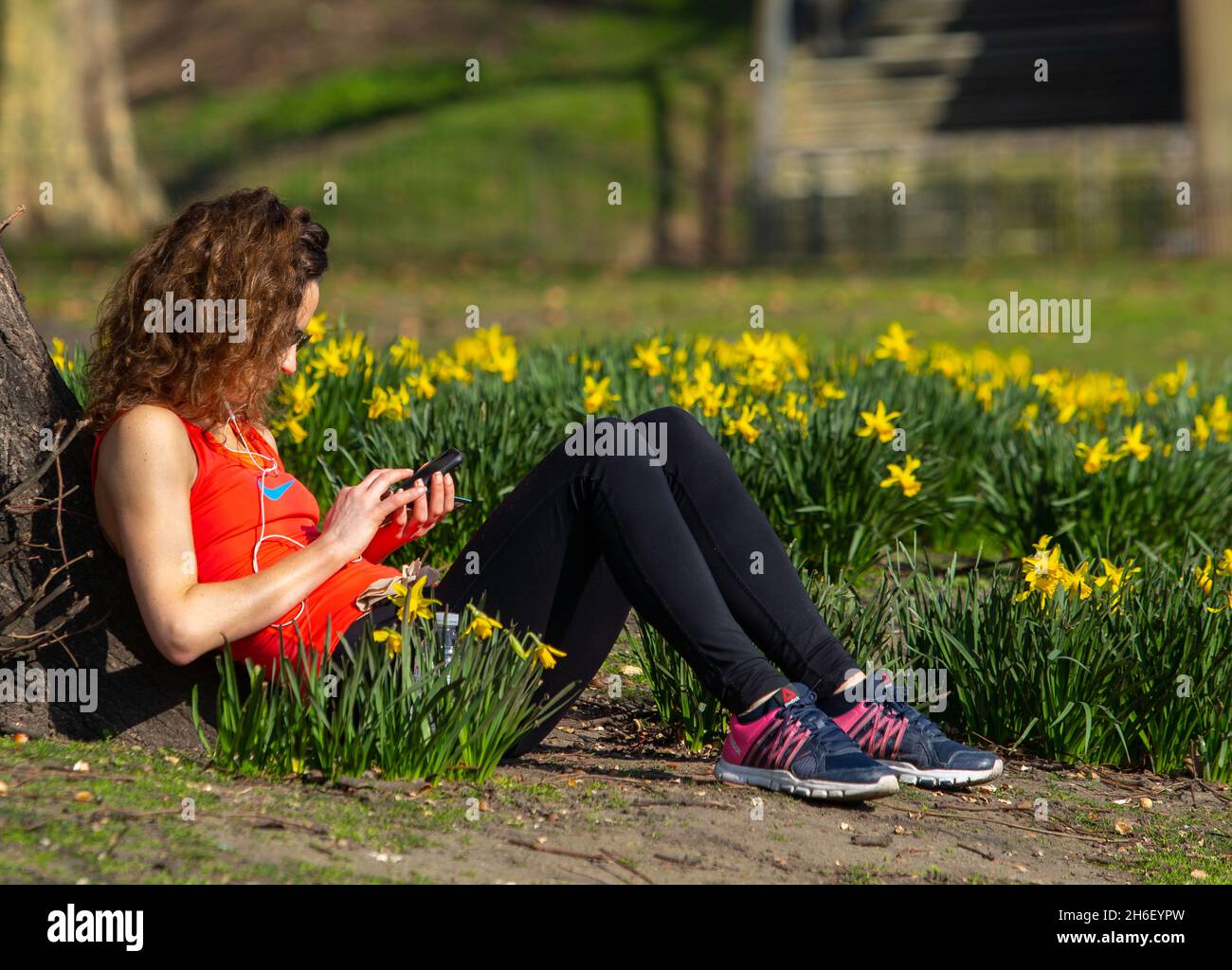 Members of the public enjoy the sunshine in St James Park in central ...