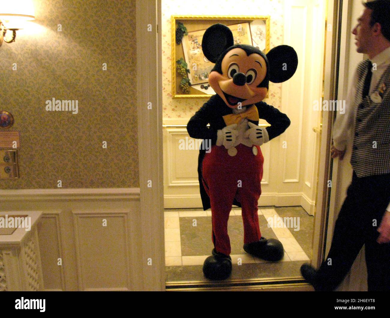 Mickey Mouse gets into the lift at the Disneyland hotel, during the ...