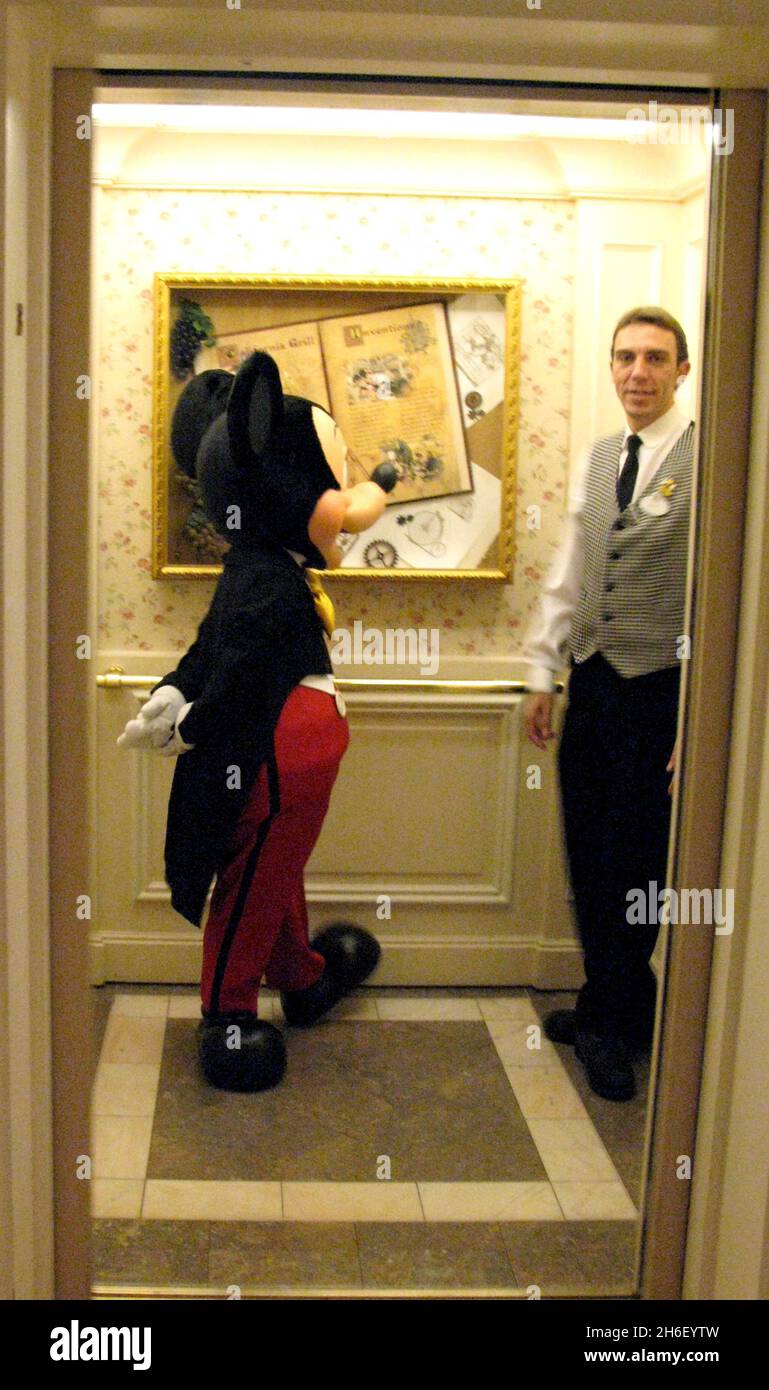 Mickey Mouse gets into the lift at the Disneyland hotel, during the ...