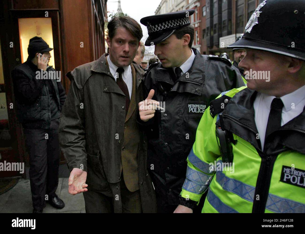 BNP member Richard Barnbrook is taken into the London Coliseum via the ...