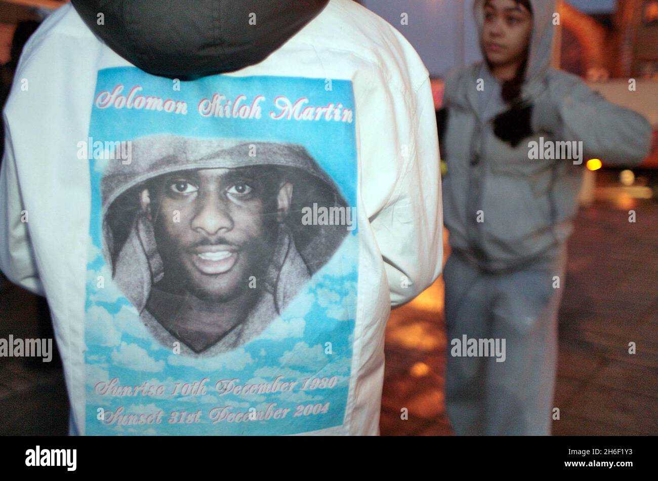 A cousin of 2004 murder victim Solomon Martin wears a tshirt depicting ...