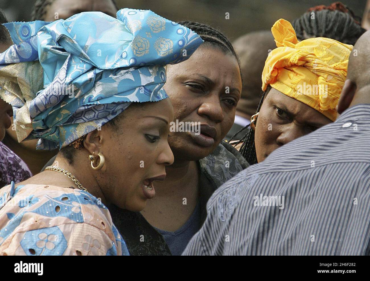 Ivie, the mother (centre) of 14 year old Paul Erhahon who was stabbed ...