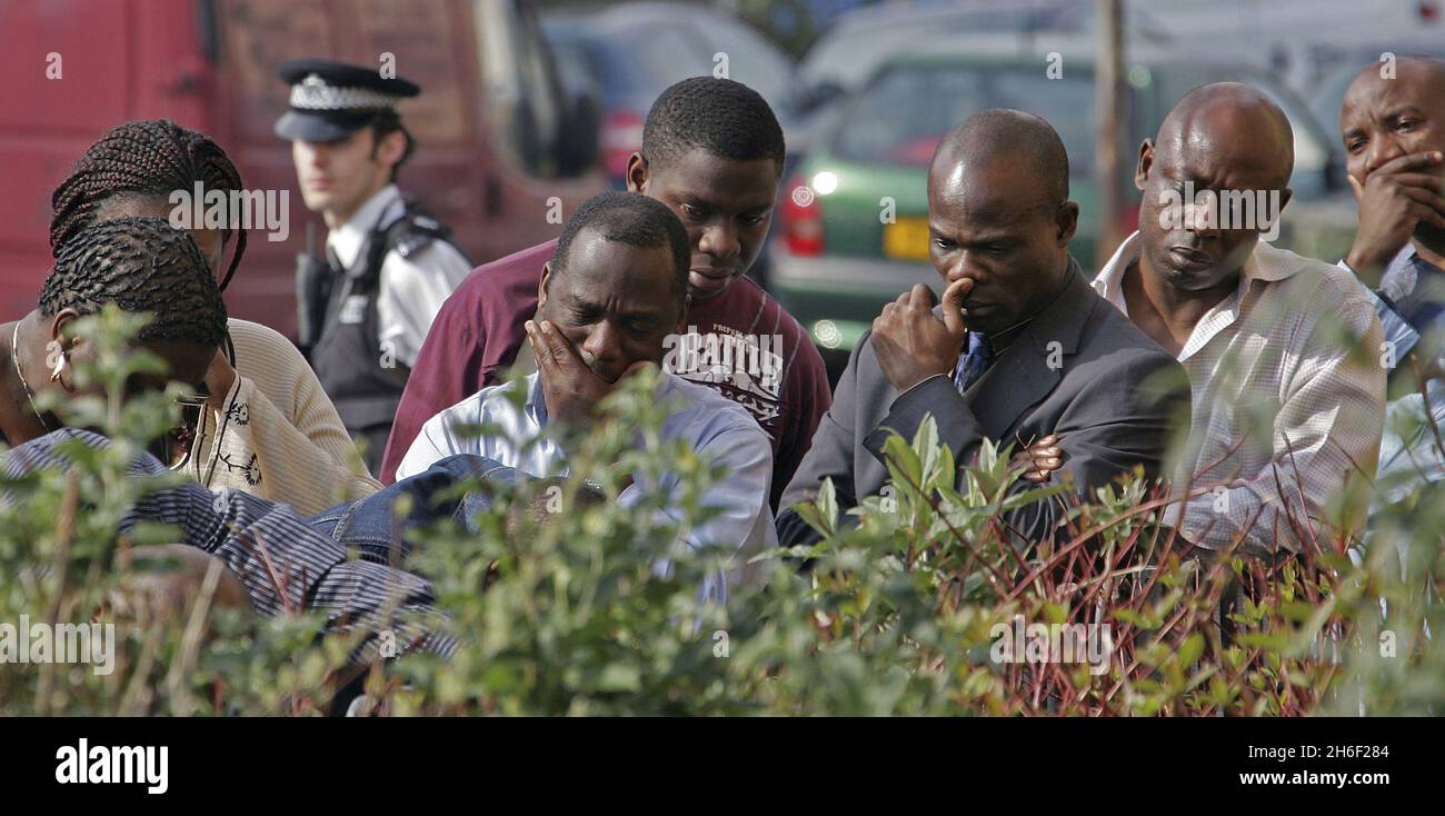 Family members of 14 year old Paul Erhahon who was stabbed to death in ...
