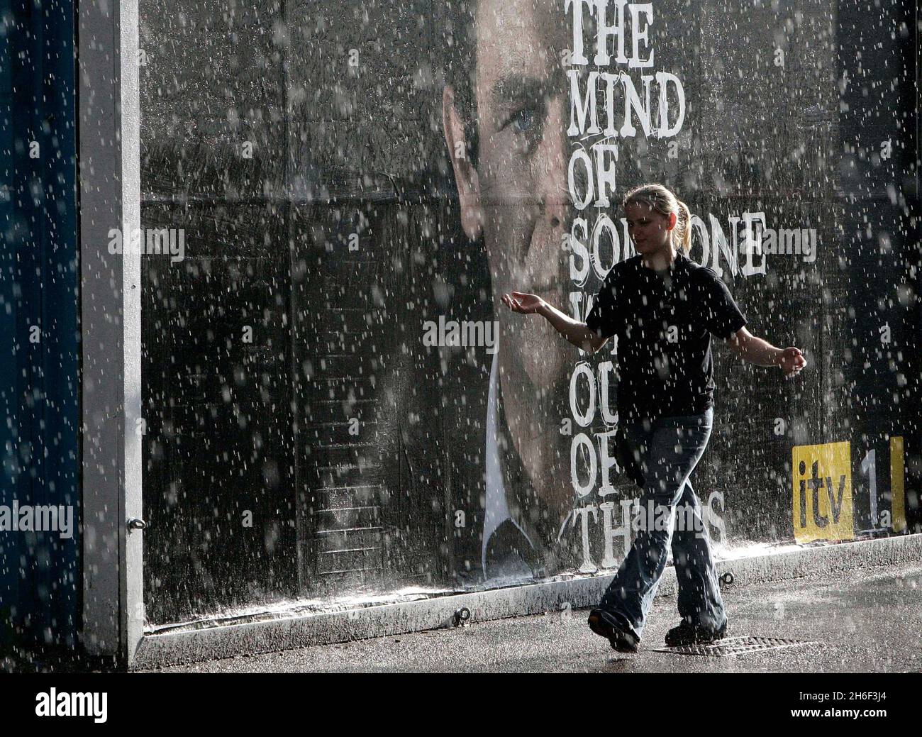People run from the rain in east London after thunder storms hit the ...