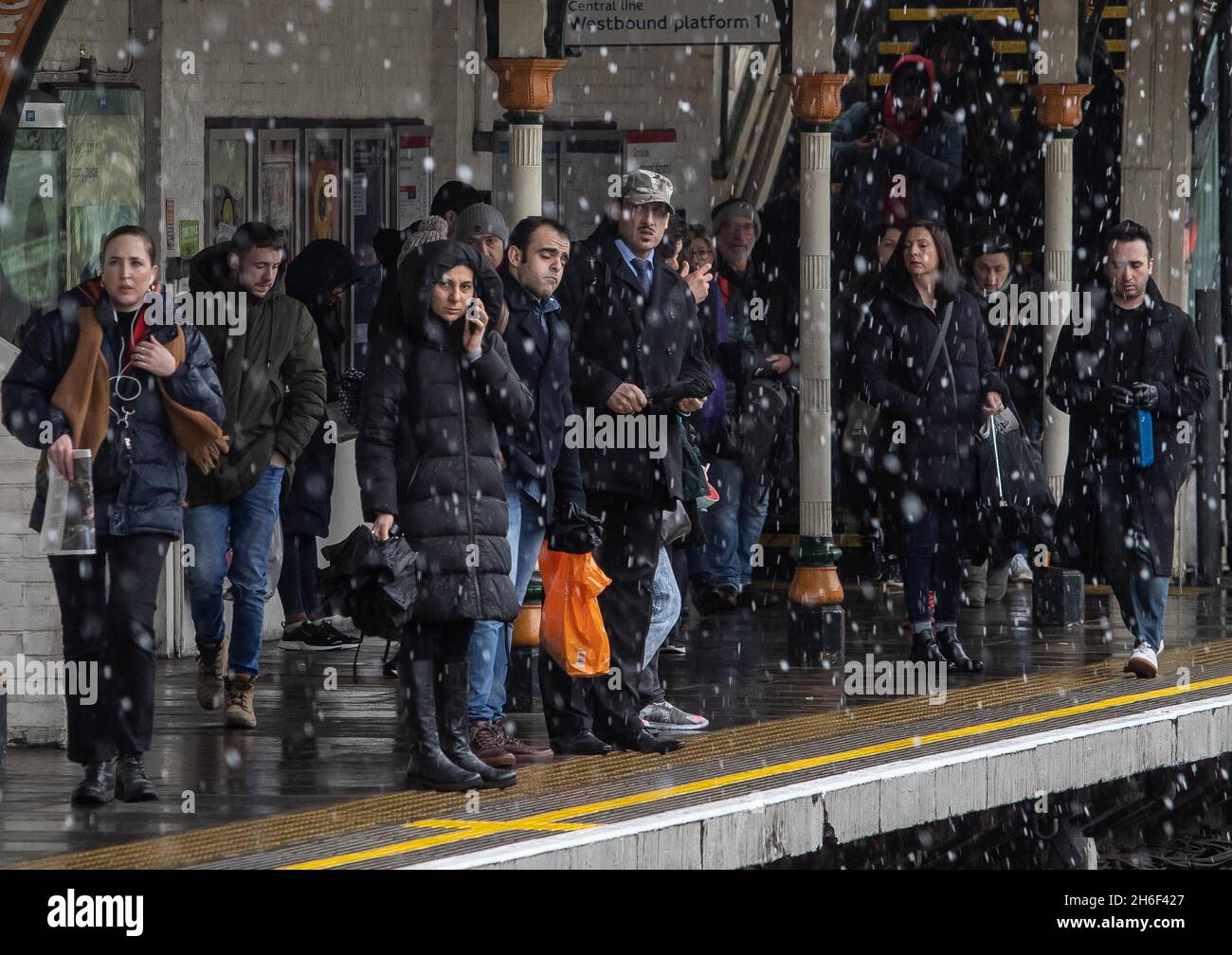 Commuters travel to work in the snow in London Stock Photo - Alamy