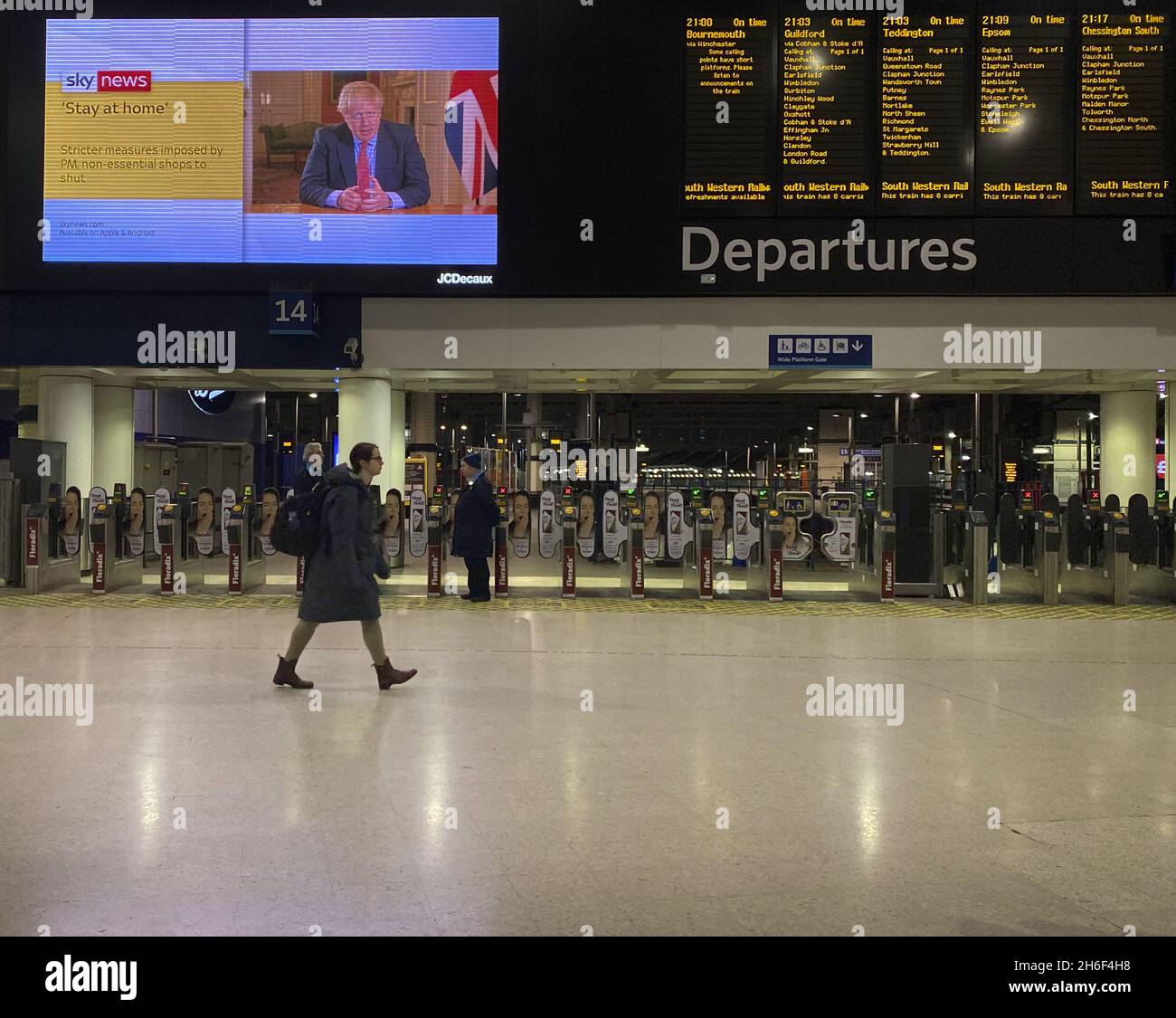 A screen at Waterloo station in London shows the PM Boris Johnson ...