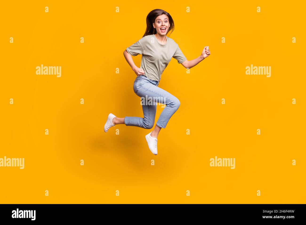 Full length body size view of nice thin funny cheerful girl jumping ...
