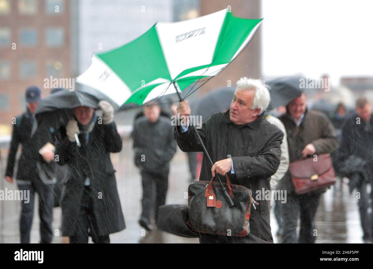 As severe storms move across the UK, wind and rain batter commuters on ...