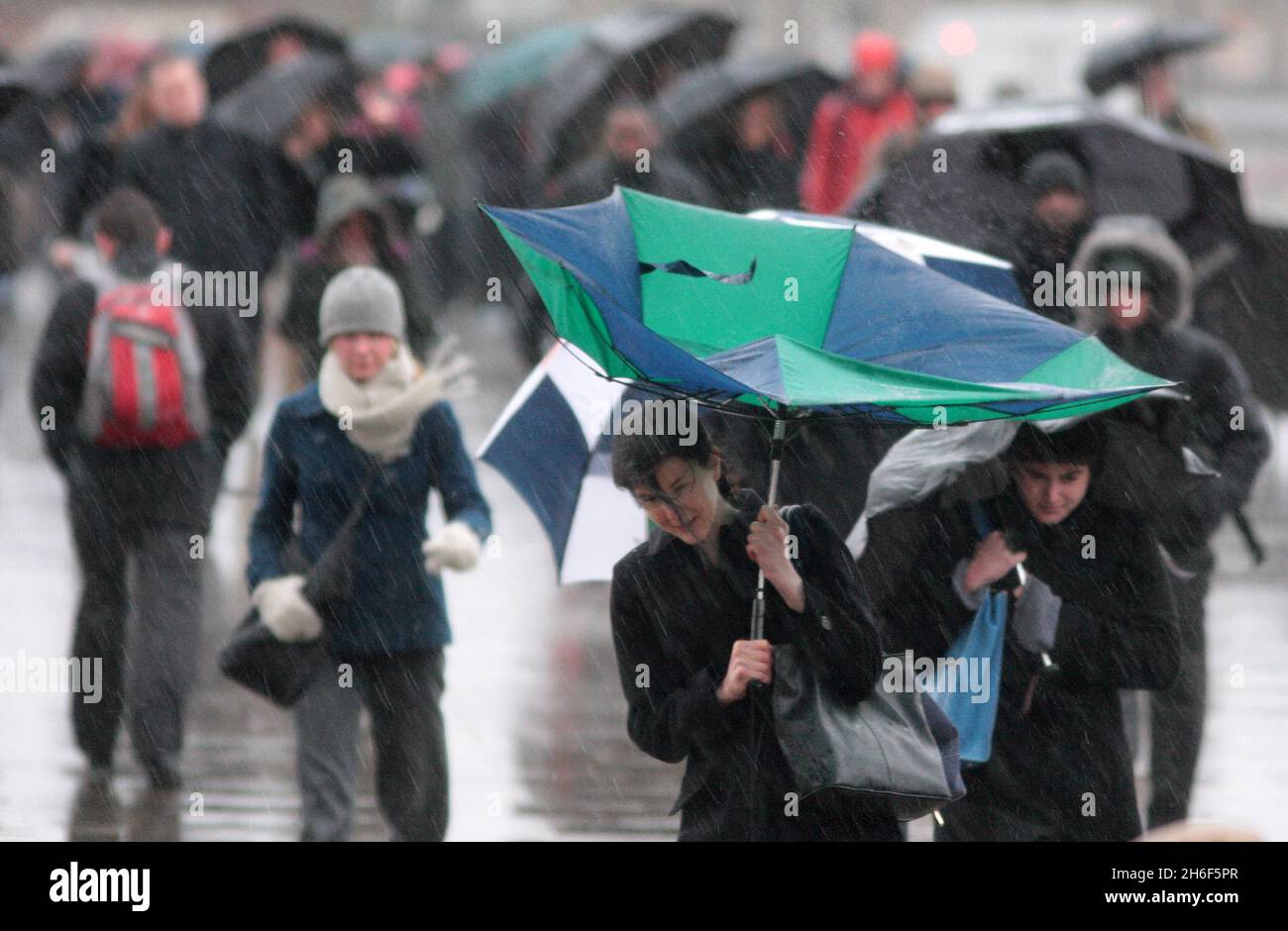 As severe storms move across the UK, wind and rain batter commuters on ...