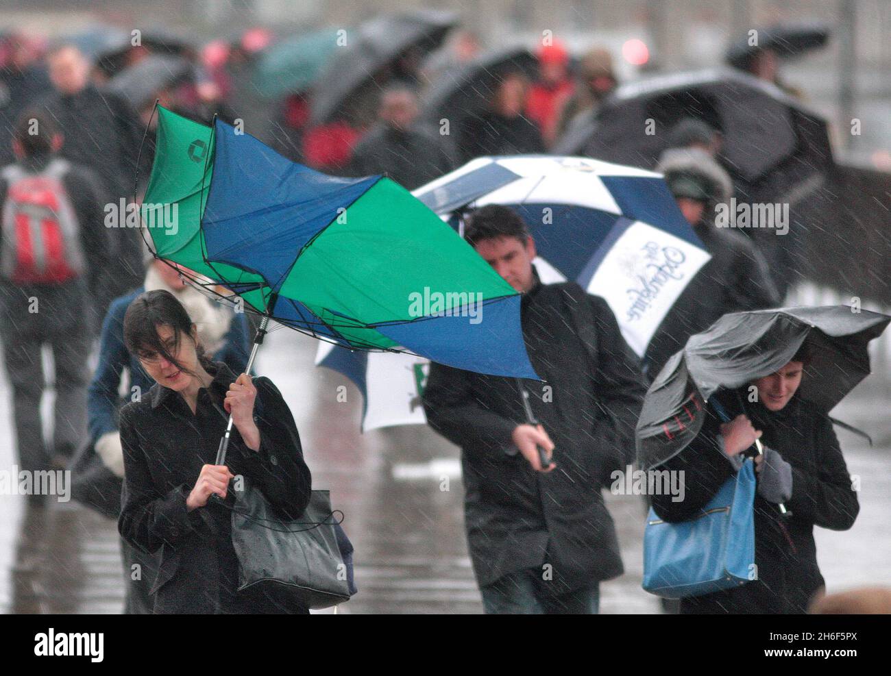 As severe storms move across the UK, wind and rain batter commuters on ...