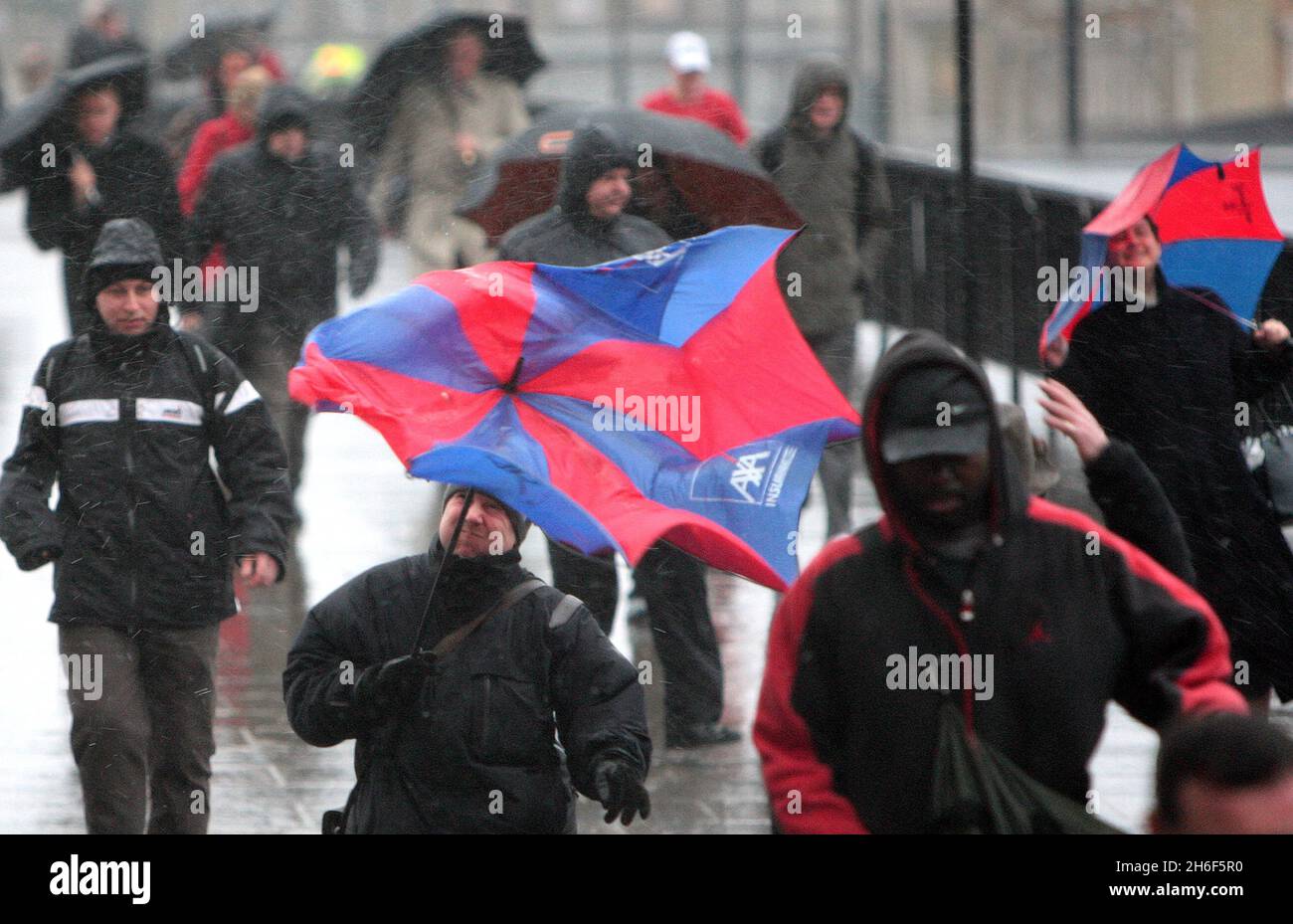 As severe storms move across the UK, wind and rain batter commuters on ...