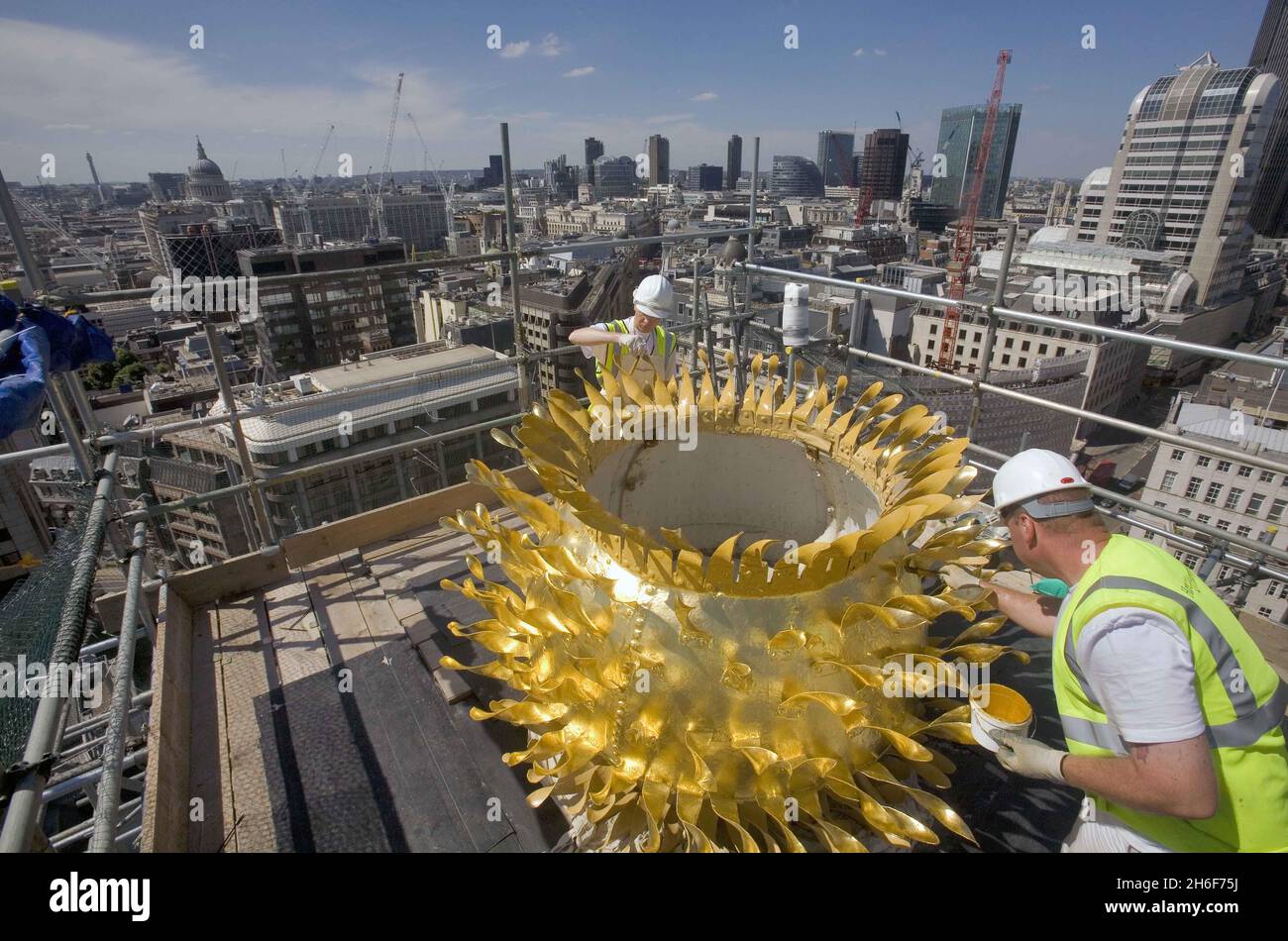 Restoration begins by gilding the famous flaming orb at the top of ...