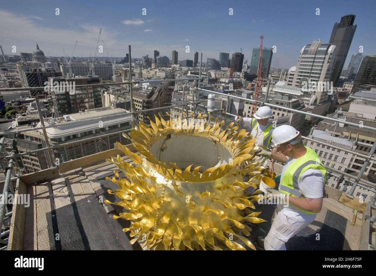 Restoration begins by gilding the famous flaming orb at the top of ...