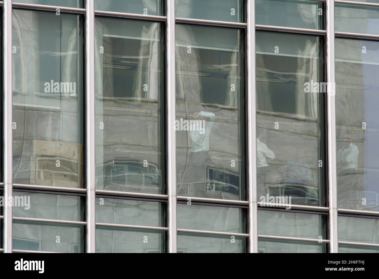 Staff at windows of the Lehman Brothers building in the city of London ...