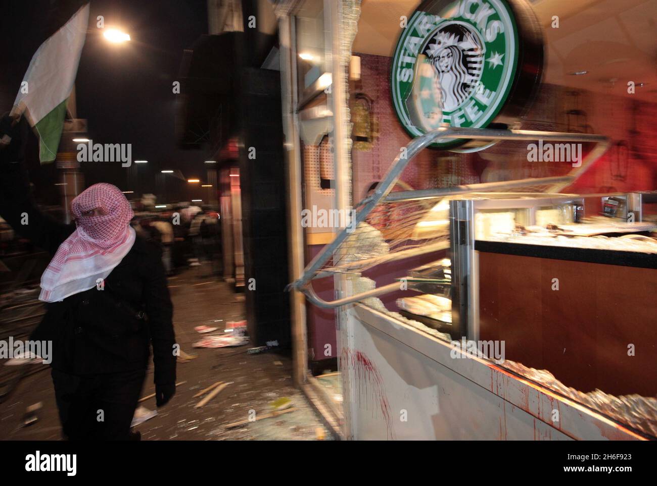 The windows of a Starbucks coffee branch are smashed during a protest ...