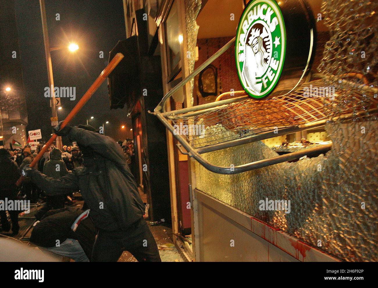The windows of a Starbucks coffee branch are smashed during a protest ...