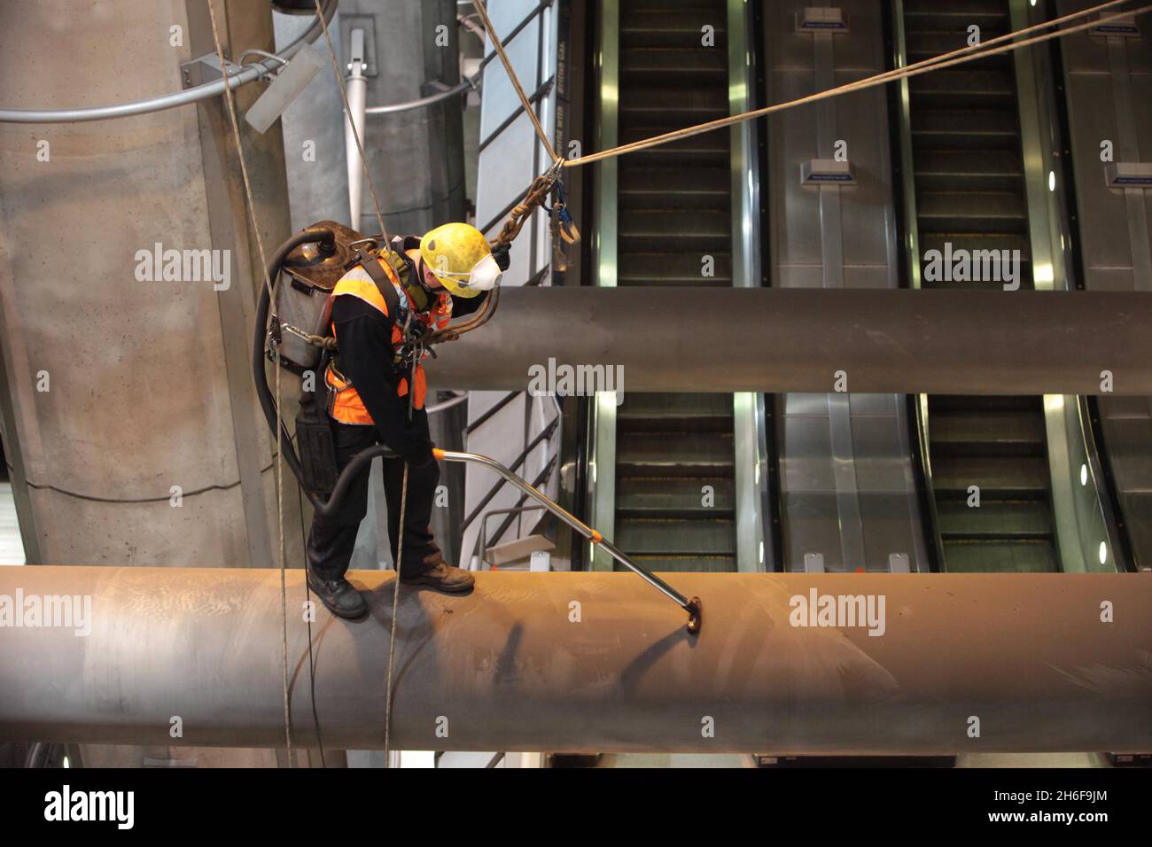 A team of abseilers clean Westminster Tube Station. The team of ...