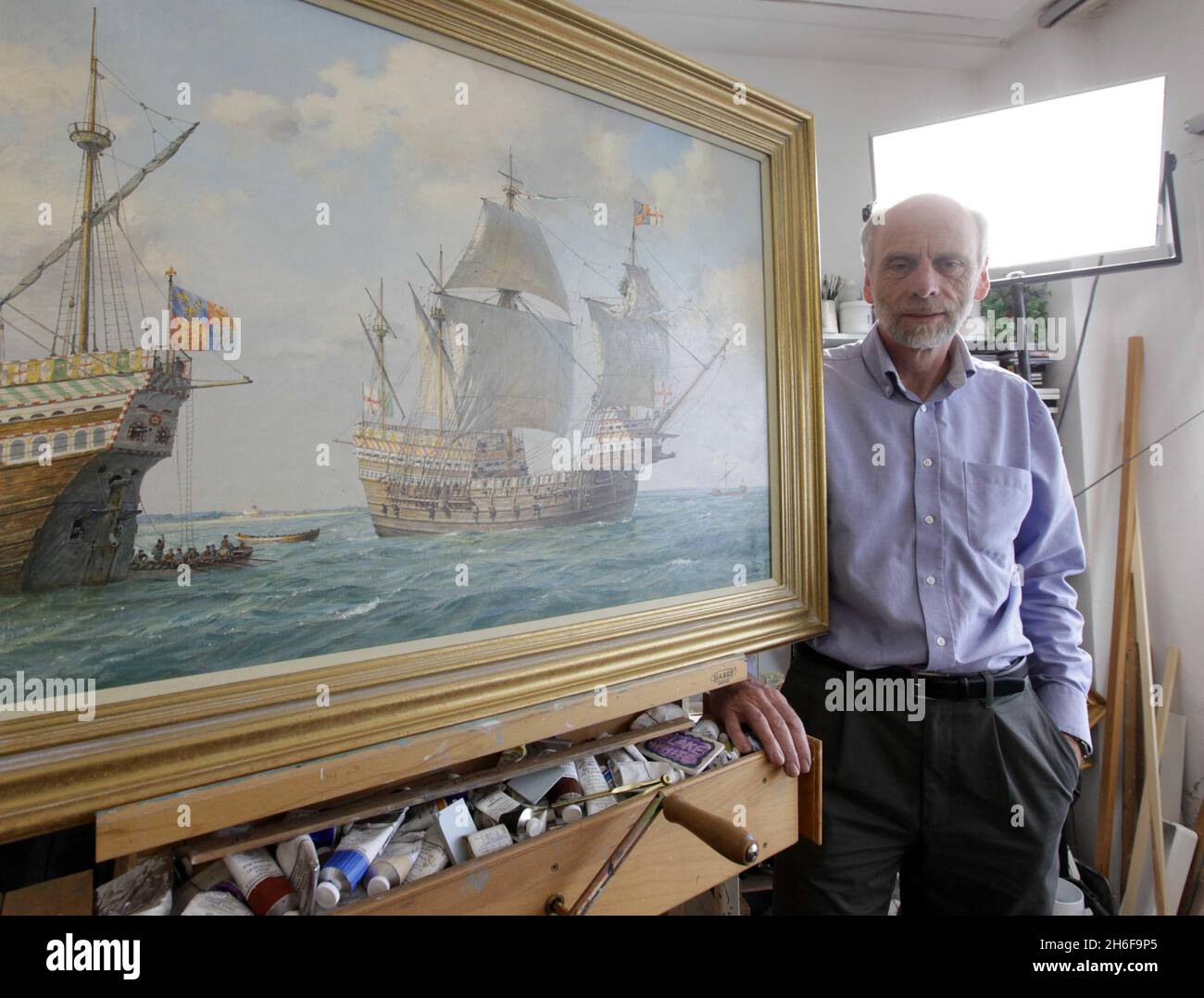 Marine artist Geoff Hunt with his painting of the Mary Rose in his ...